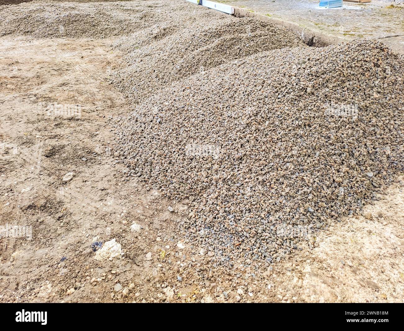 one large pile of gray rubble and small stones in the street road Stock ...