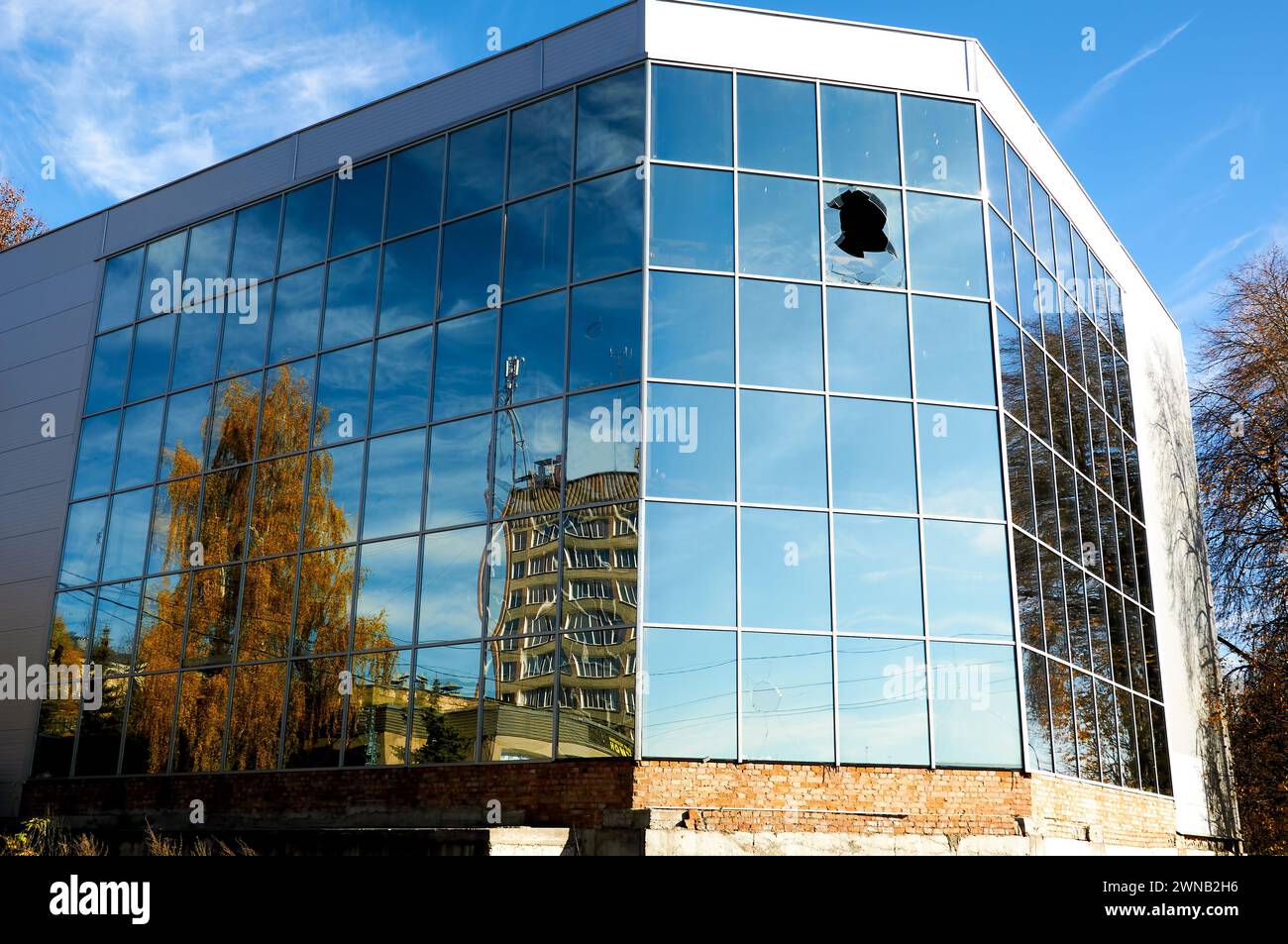Broken office window Stock Photo - Alamy