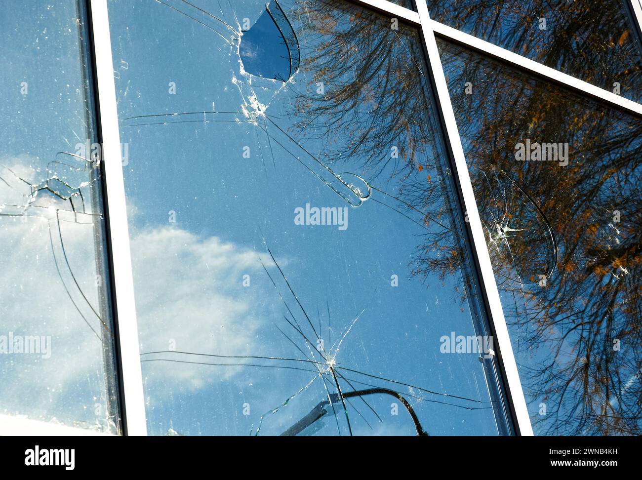 Broken office window Stock Photo - Alamy