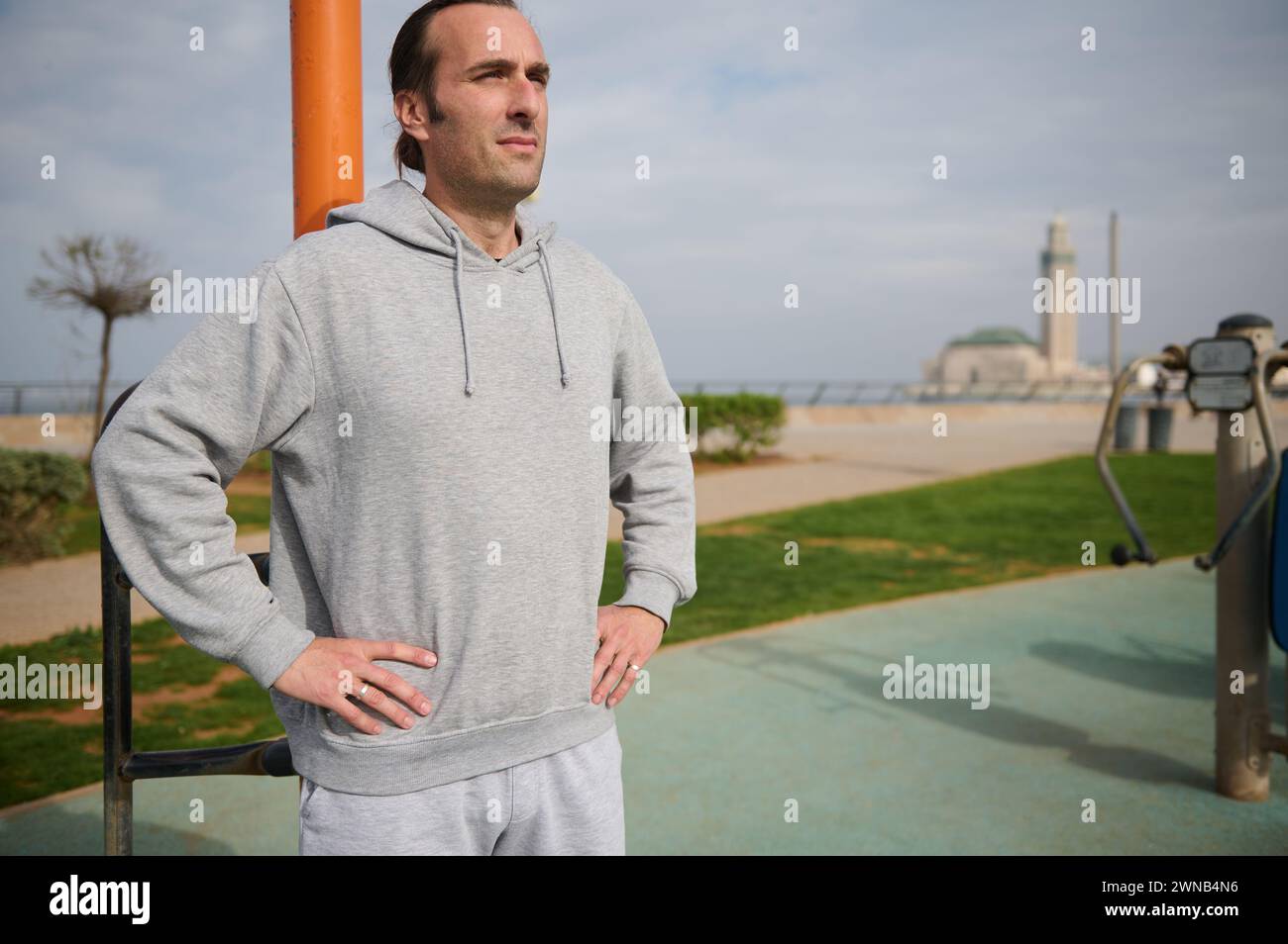 Confident portrait of a sportsman exercising outdoor on the urban ...
