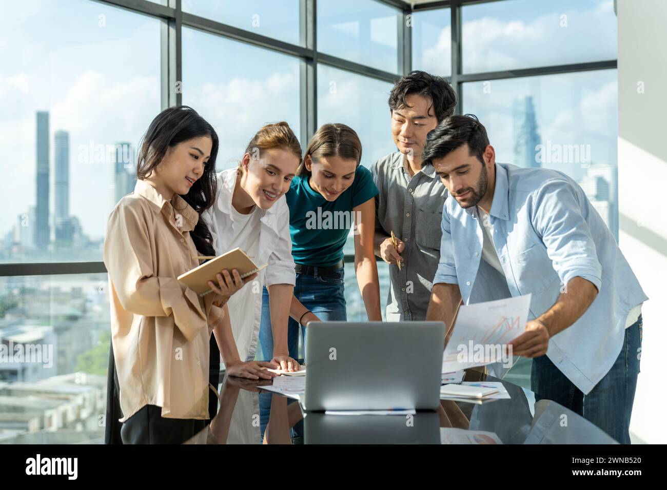 Asian project manager uses laptop displayed data analysis while ...