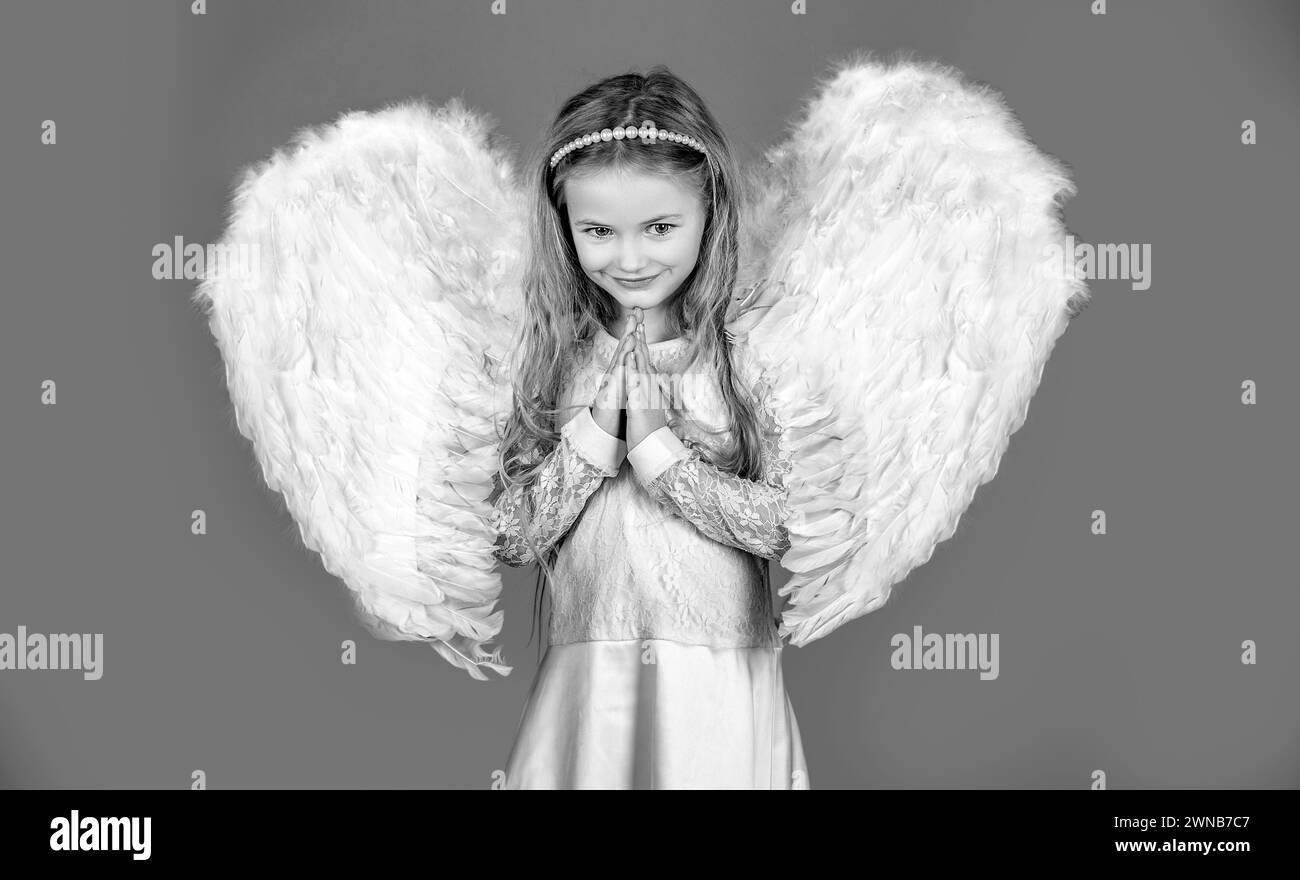 Child with angelic face. Cute child girl posing with angel wings ...