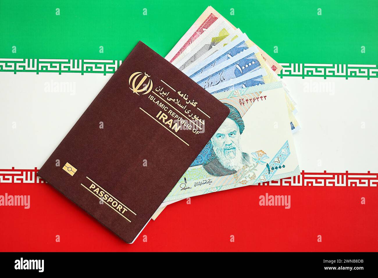 Red Islamic Republic of Iran passport and iranian reals money bills ...