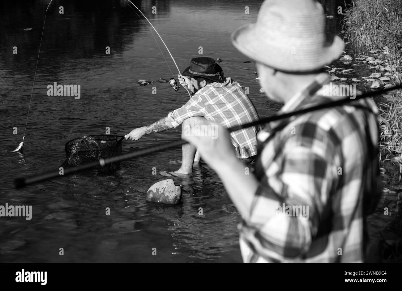 Bearded men catching fish. lear water river. Hobby sport activity ...