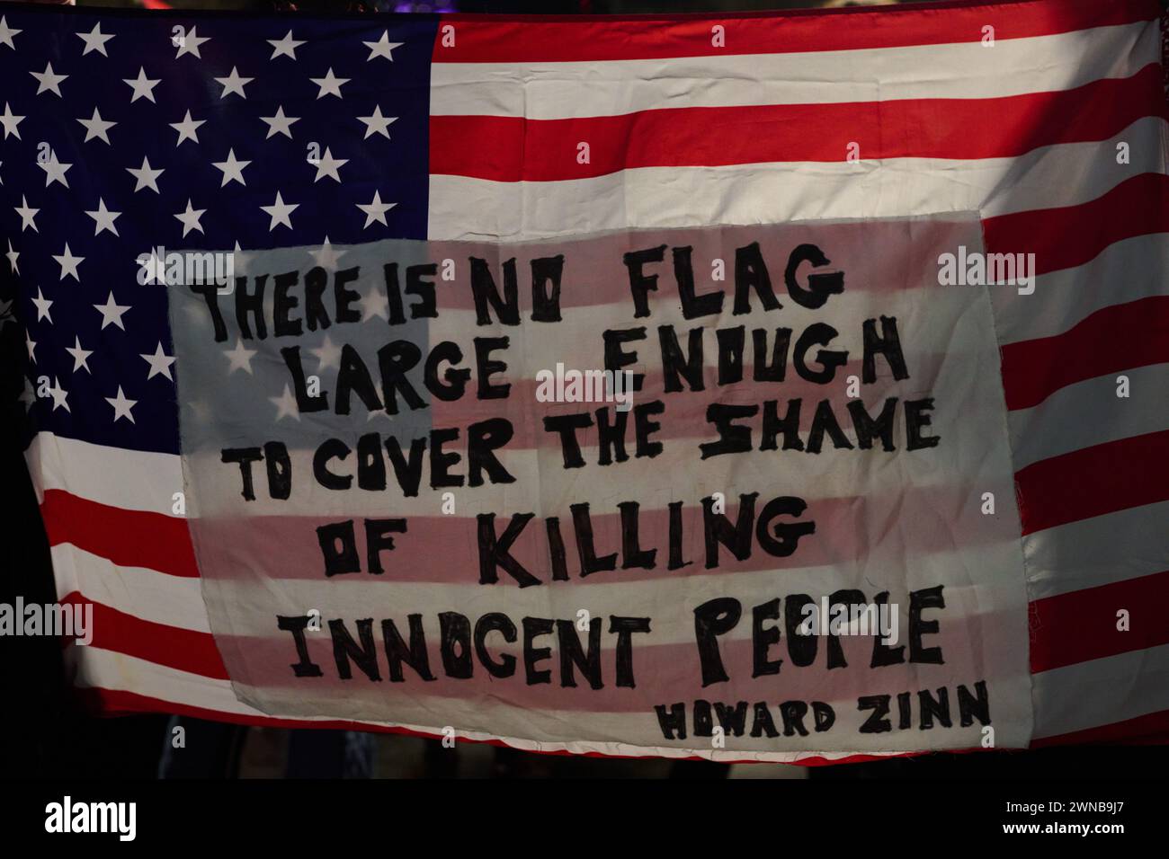 Brooklyn, New York, USA. 29th Feb, 2024. A US flag is carried that ...