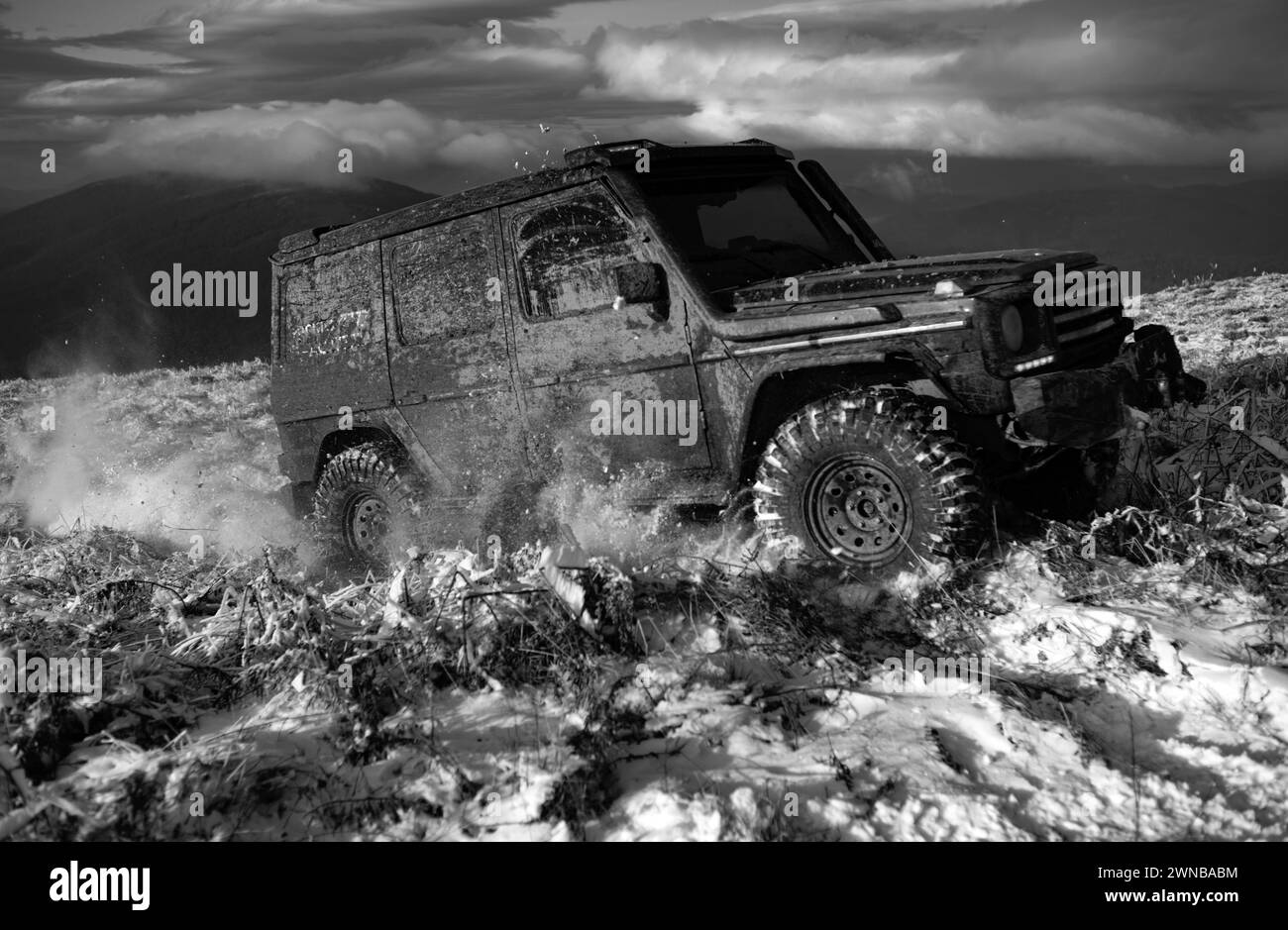 Front view of massive 4x4 off-road car on the dirty snowed ground ...