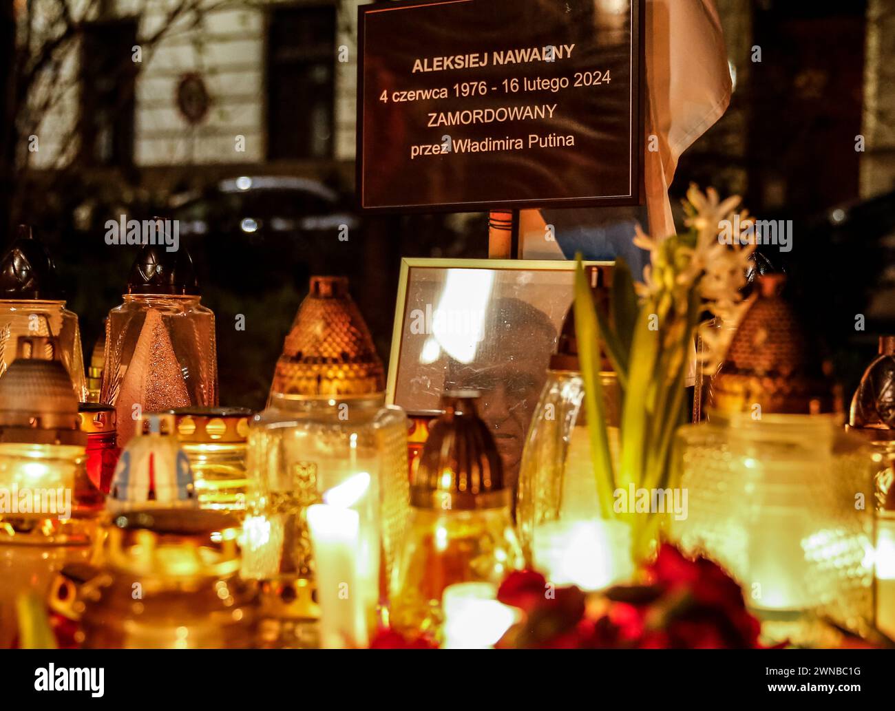 A Alexei Navalny portrait, lights and flowers are seen in front of the ...