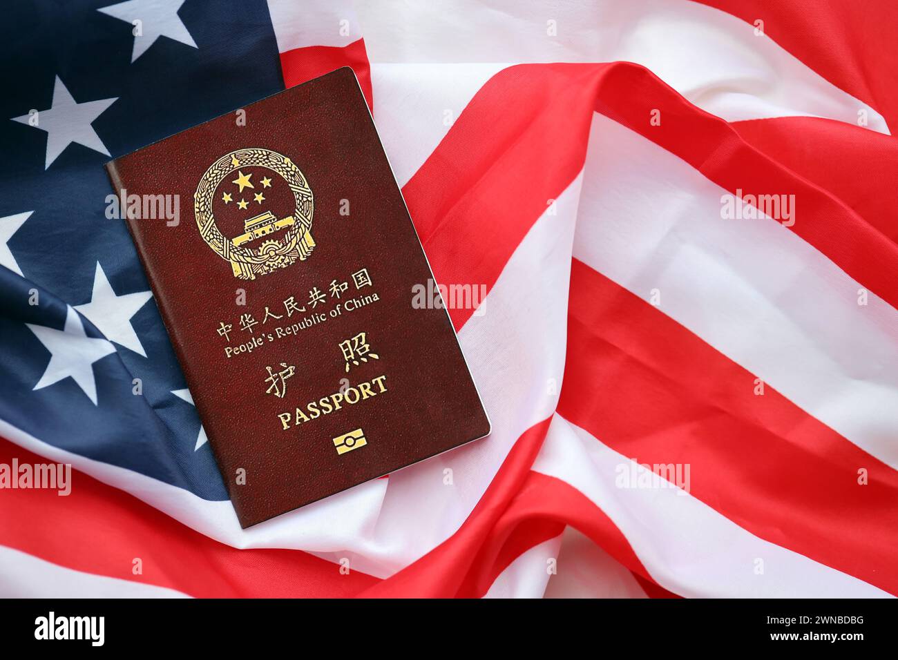Red passport of People Republic of China on United States flag. PRC ...