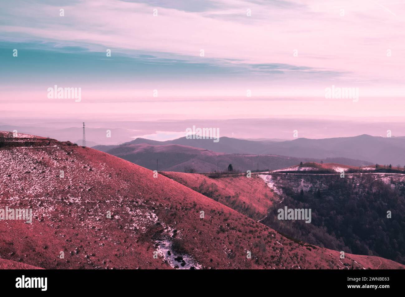 The winding road in the rounded mountains. Panoramic view from ...