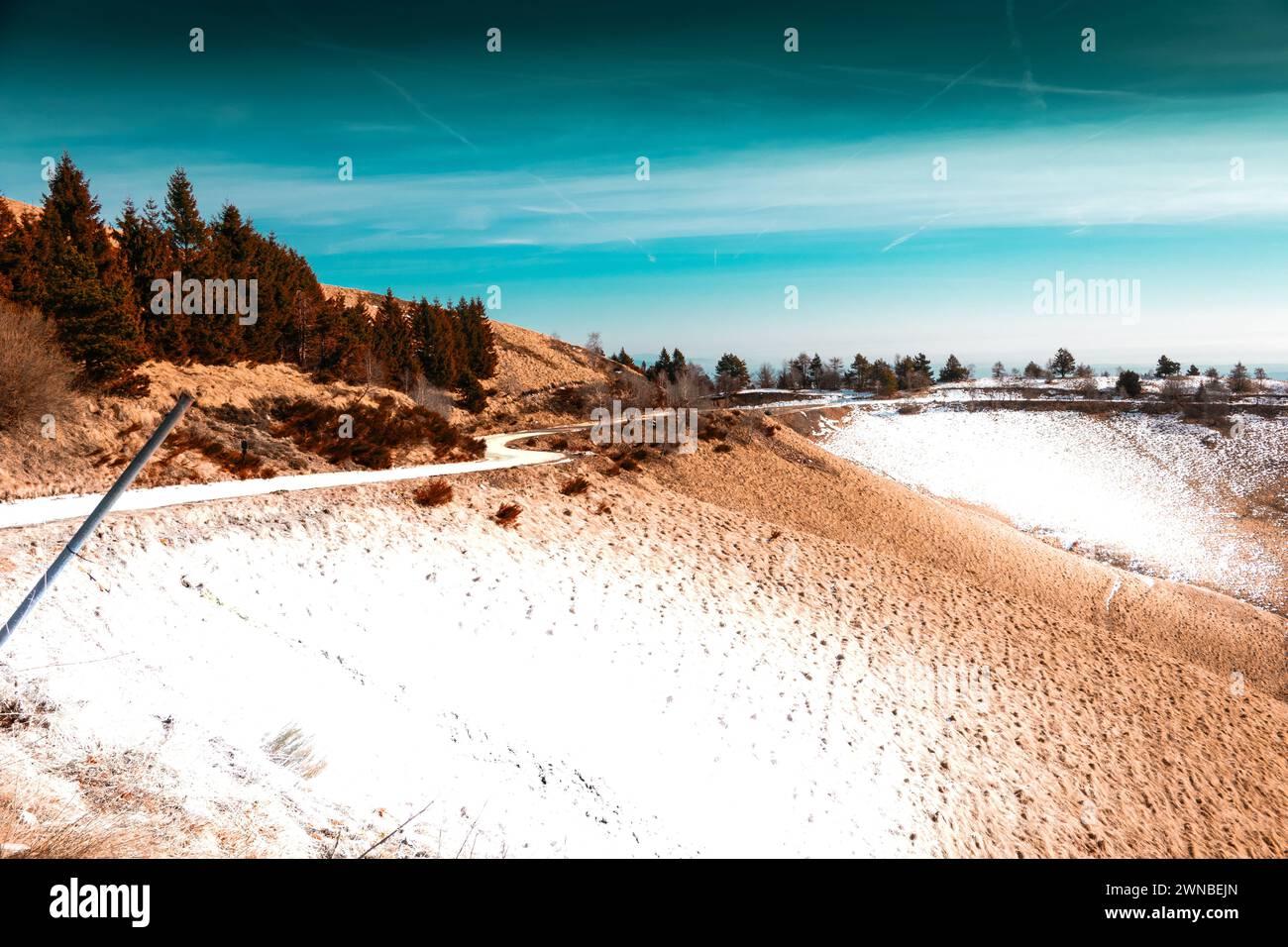 The winding road in the rounded mountains. Panoramic view from ...
