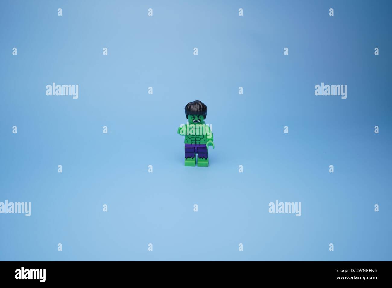 A Lego Hulk isolated against an empty blue background Stock Photo - Alamy
