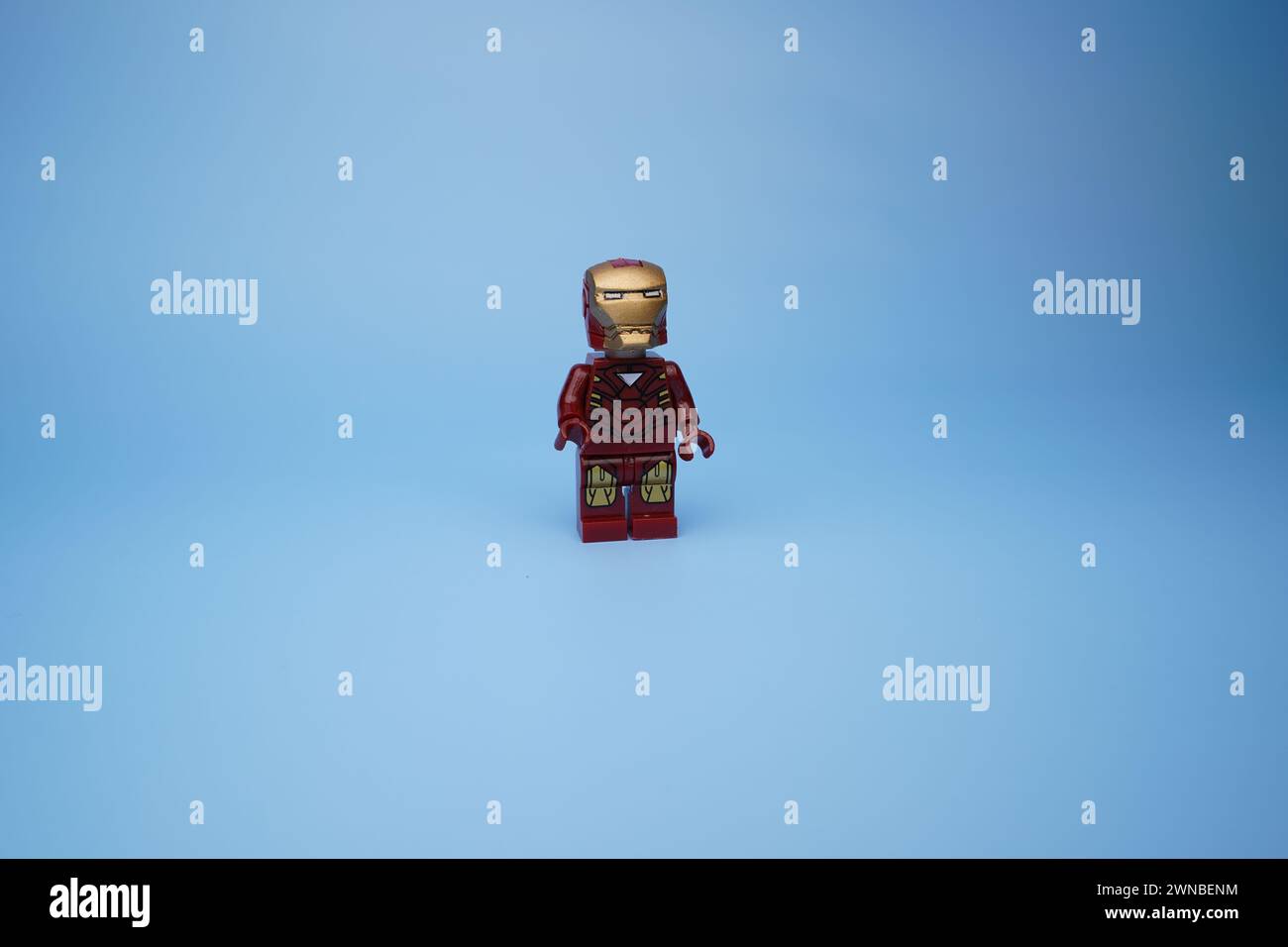 A Lego Iron Man isolated against an empty blue background Stock Photo ...