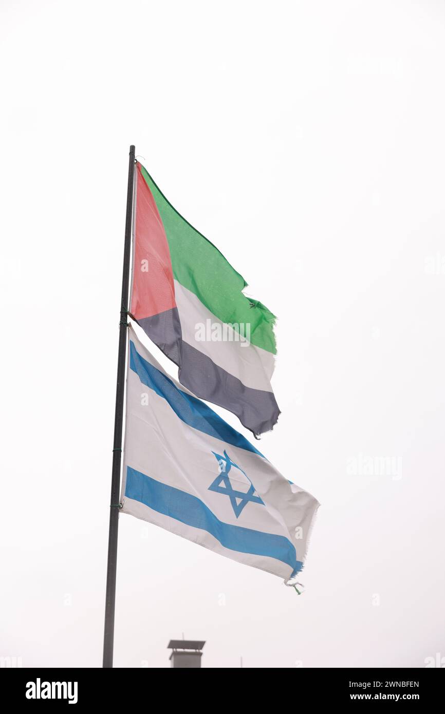 Two flags are flying side by side Stock Photo - Alamy