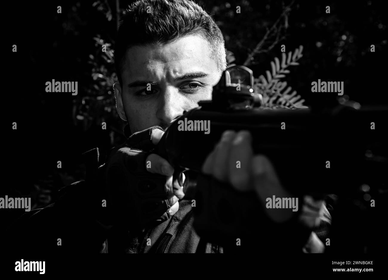 Hunter with shotgun gun on hunt. Hunter Target with laser sight ...