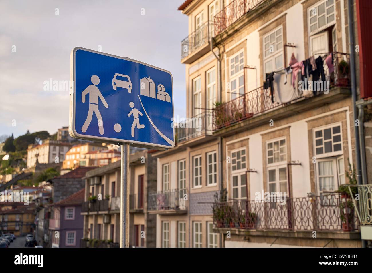 Home zone road sign in Porto, Protugal on old houses background Stock ...