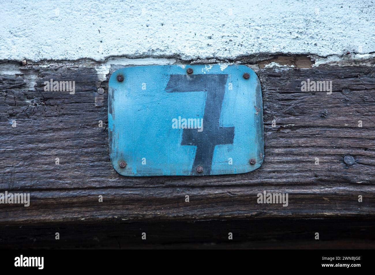 Rustic house number 7. Hand-painted blue sheet metal nailed to the ...