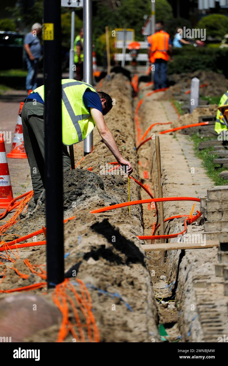 Installation and connecting fibre optic cables to neighbouring houses ...