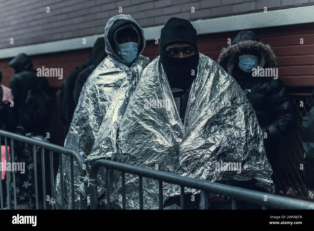 New York, USA. 16th Jan, 2024. Migrants who lack winter coats use space ...