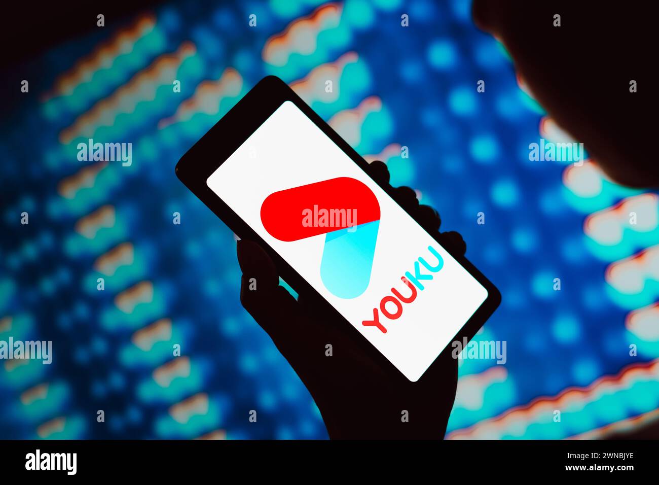 In this photo illustration, the Youku logo is displayed on a smartphone ...