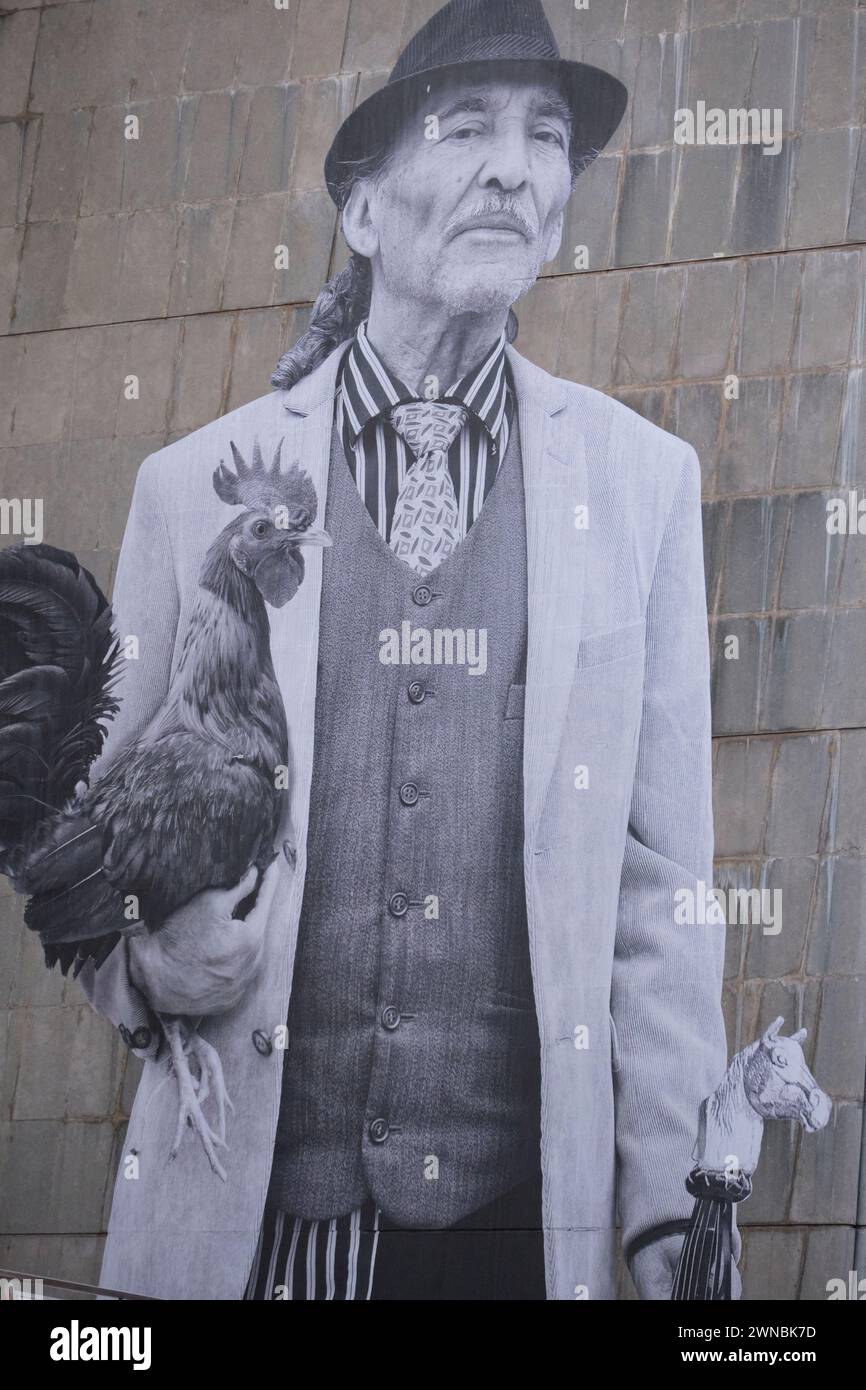 Street mural of a man with rooster, Barcelona Stock Photo - Alamy