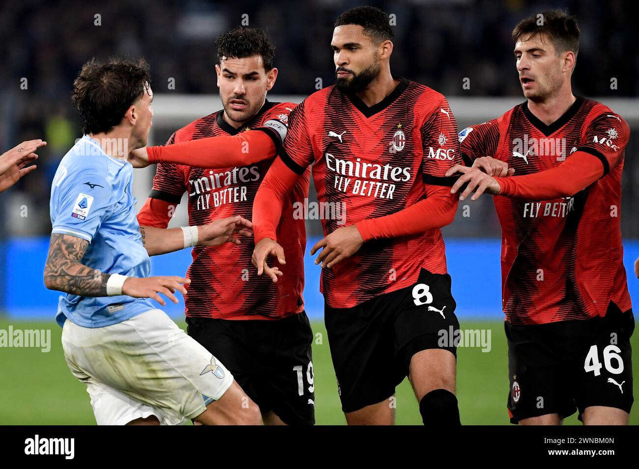 Rome, Italy. 01st Mar, 2024. Luca Pellegrini of SS Lazio argues with Christian Pulisic of AC ...