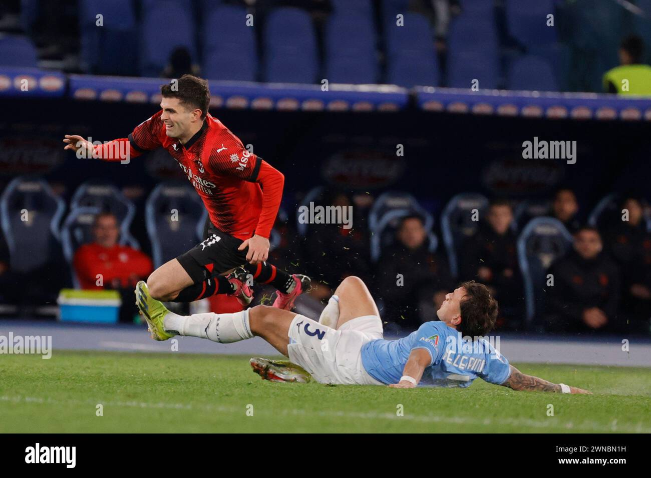Rome, Lazio, Italy. 1st Mar, 2024. Christian Pulisic of Milan is challenged by Luca Pellegrini ...