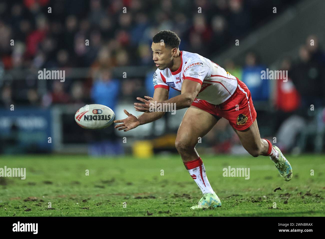 Moses Mbye of St. Helens passers during the Betfred Super League Round ...