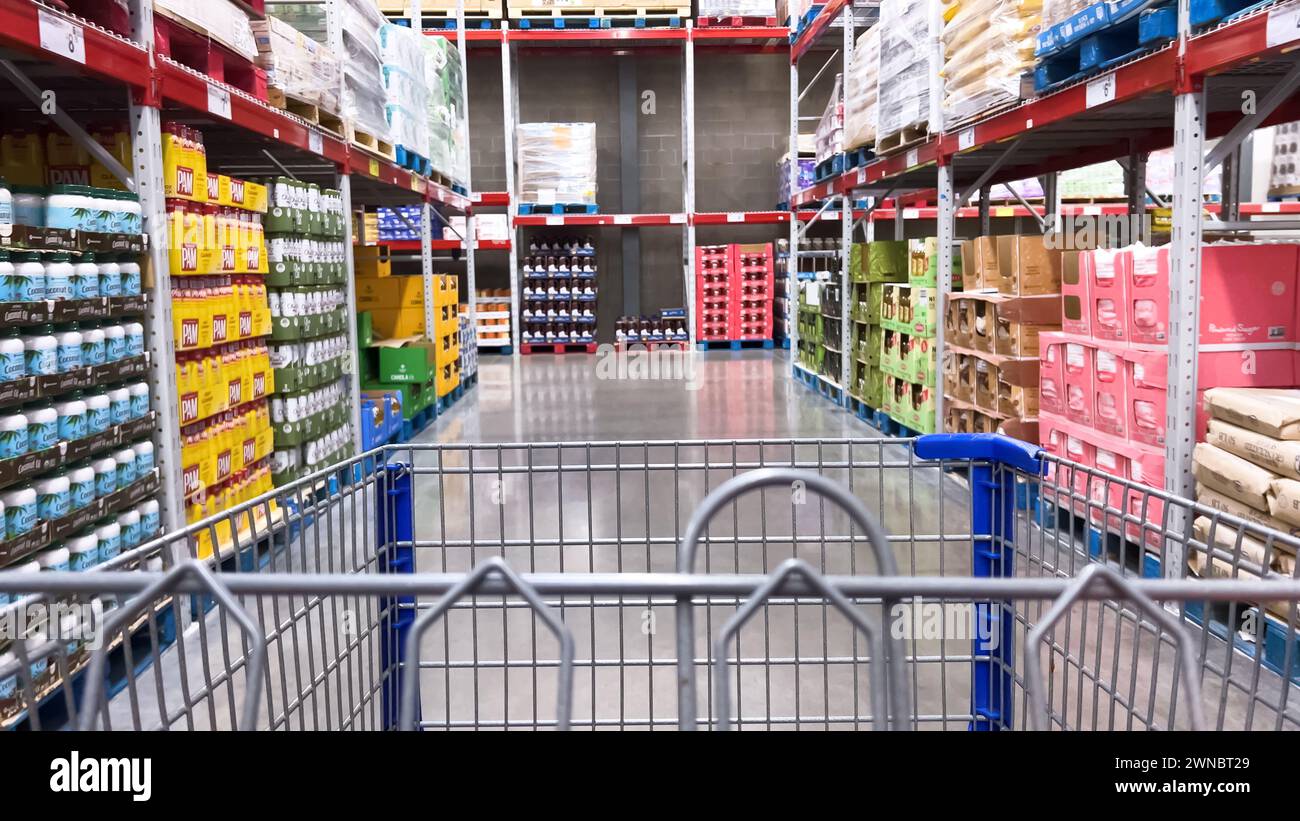 Navigating the Aisles at Sams Club with an Empty Shopping Cart Stock ...