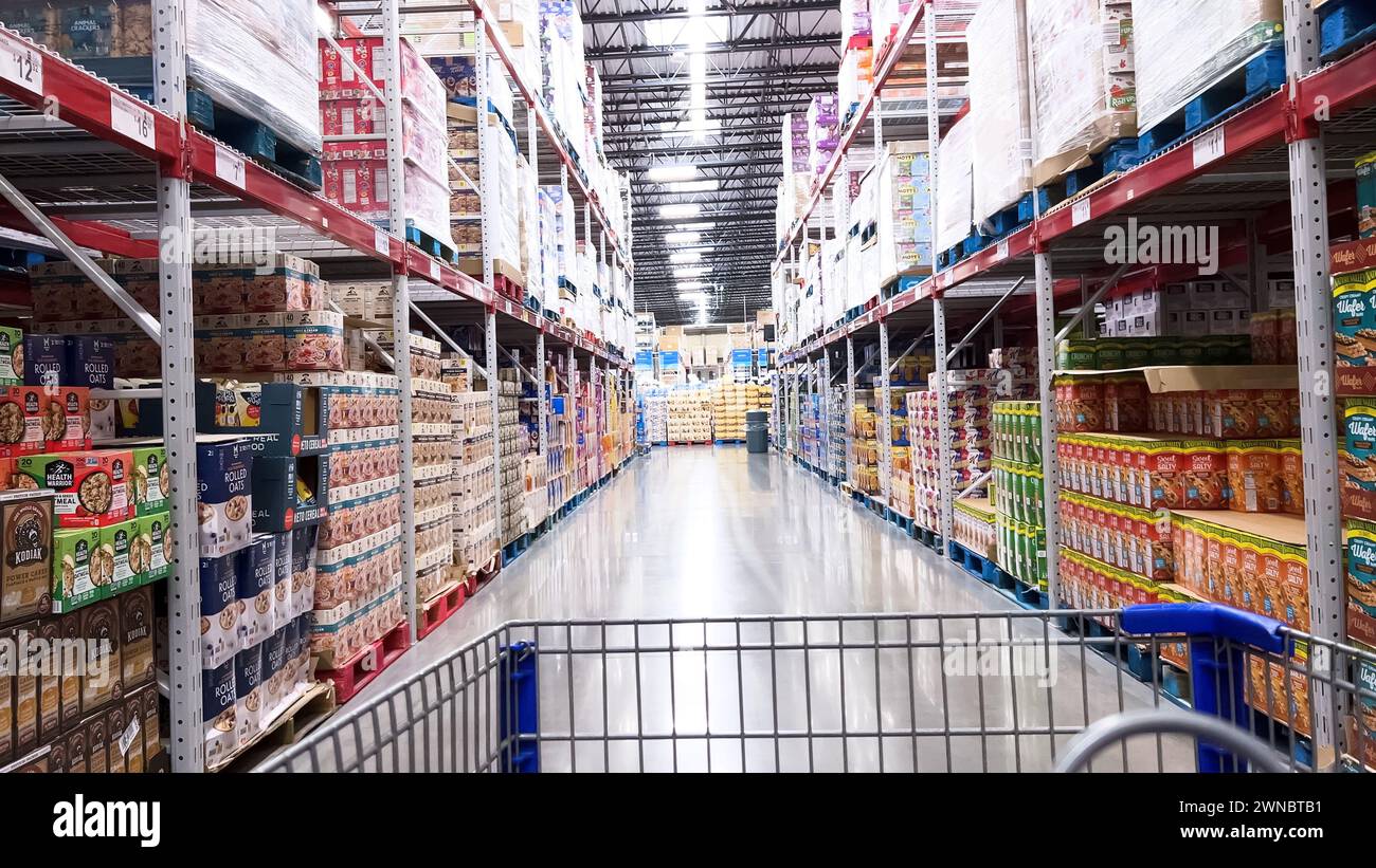 Navigating the Aisles at Sams Club with an Empty Shopping Cart Stock ...