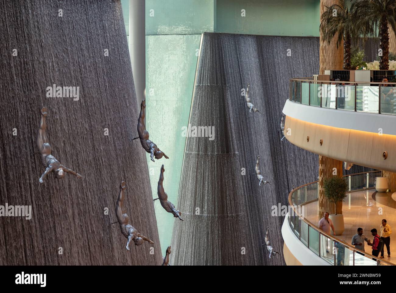 A picture of the Dubai Mall waterfalls and sculptures that decorate one ...
