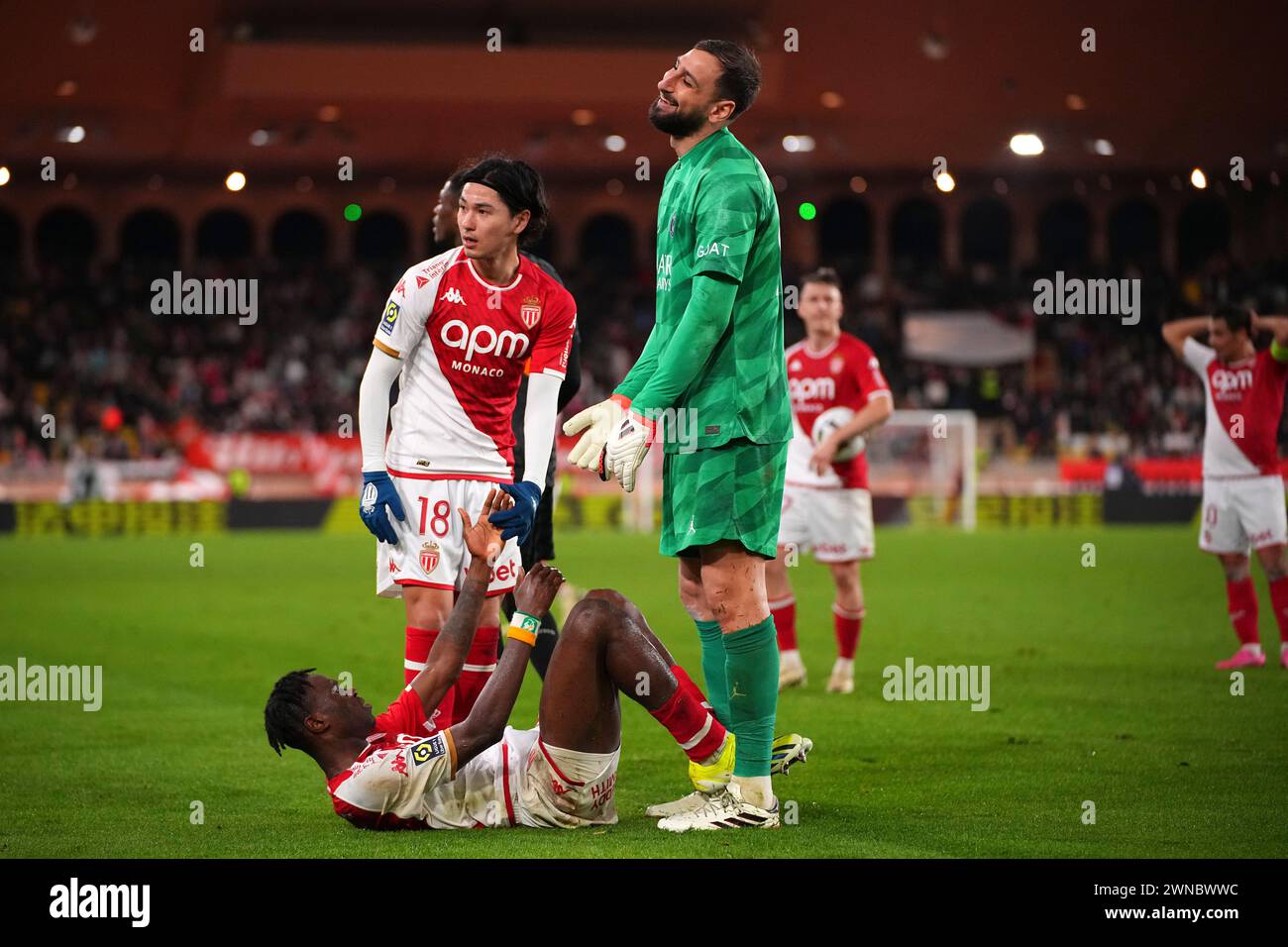 PSG's goalkeeper Gianluigi Donnarumma laughs as he stands over Monaco's ...