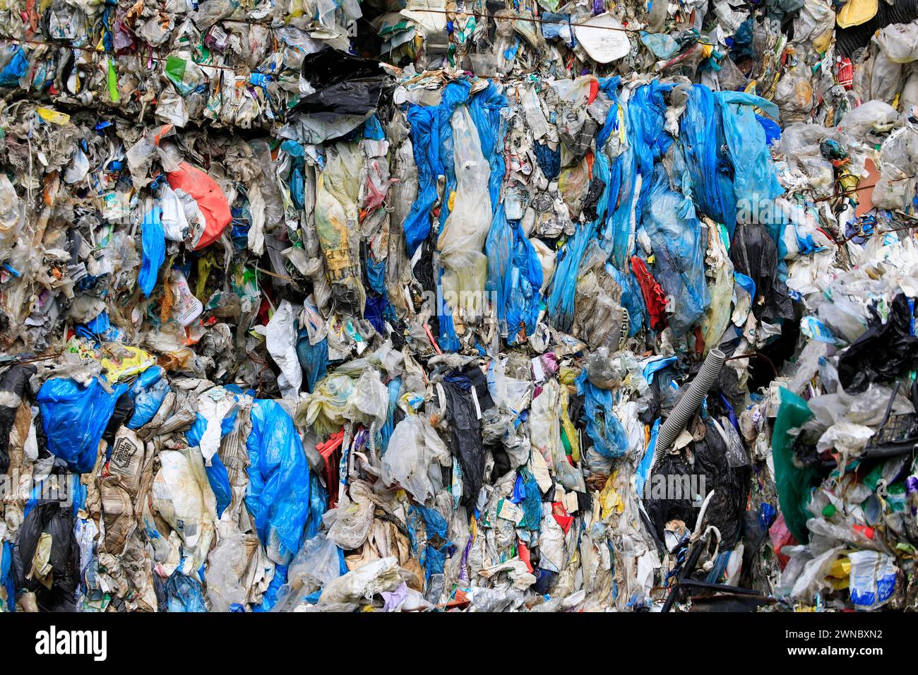 Aerial view of a large collection of stacked plastic scraps at an ...