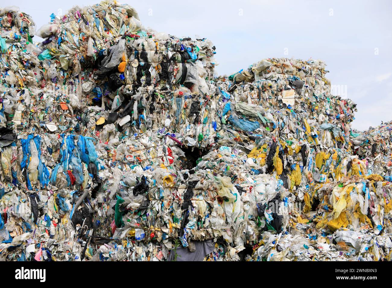 Aerial view of a large collection of stacked plastic scraps at an ...