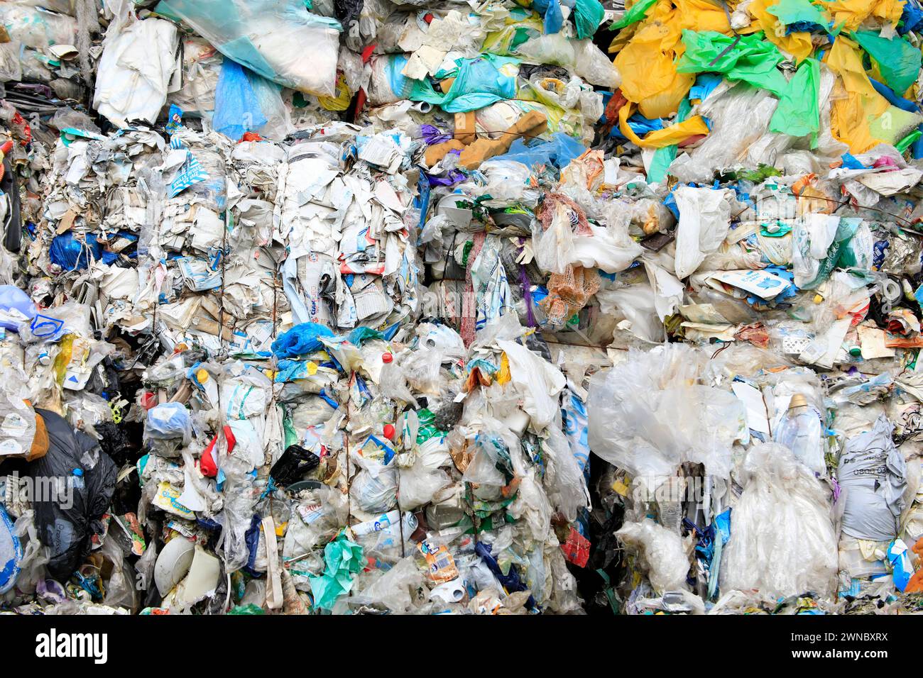 Aerial view of a large collection of stacked plastic scraps at an ...