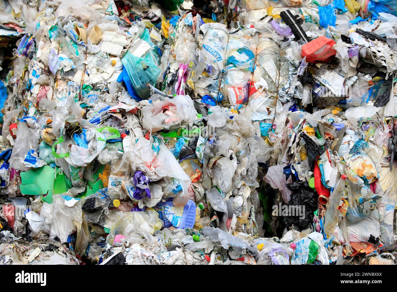 Aerial view of a large collection of stacked plastic scraps at an ...