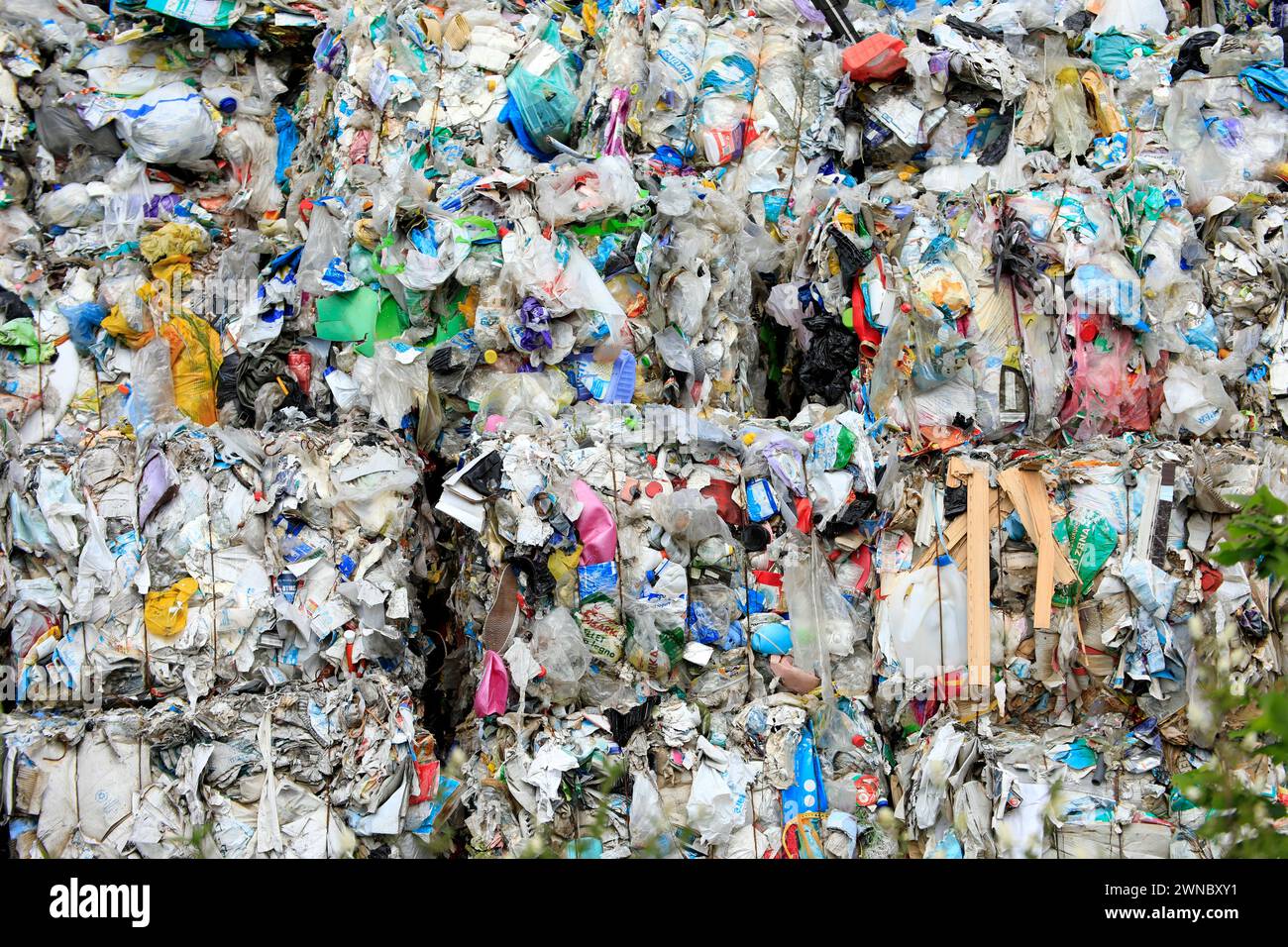 Aerial view of a large collection of stacked plastic scraps at an ...