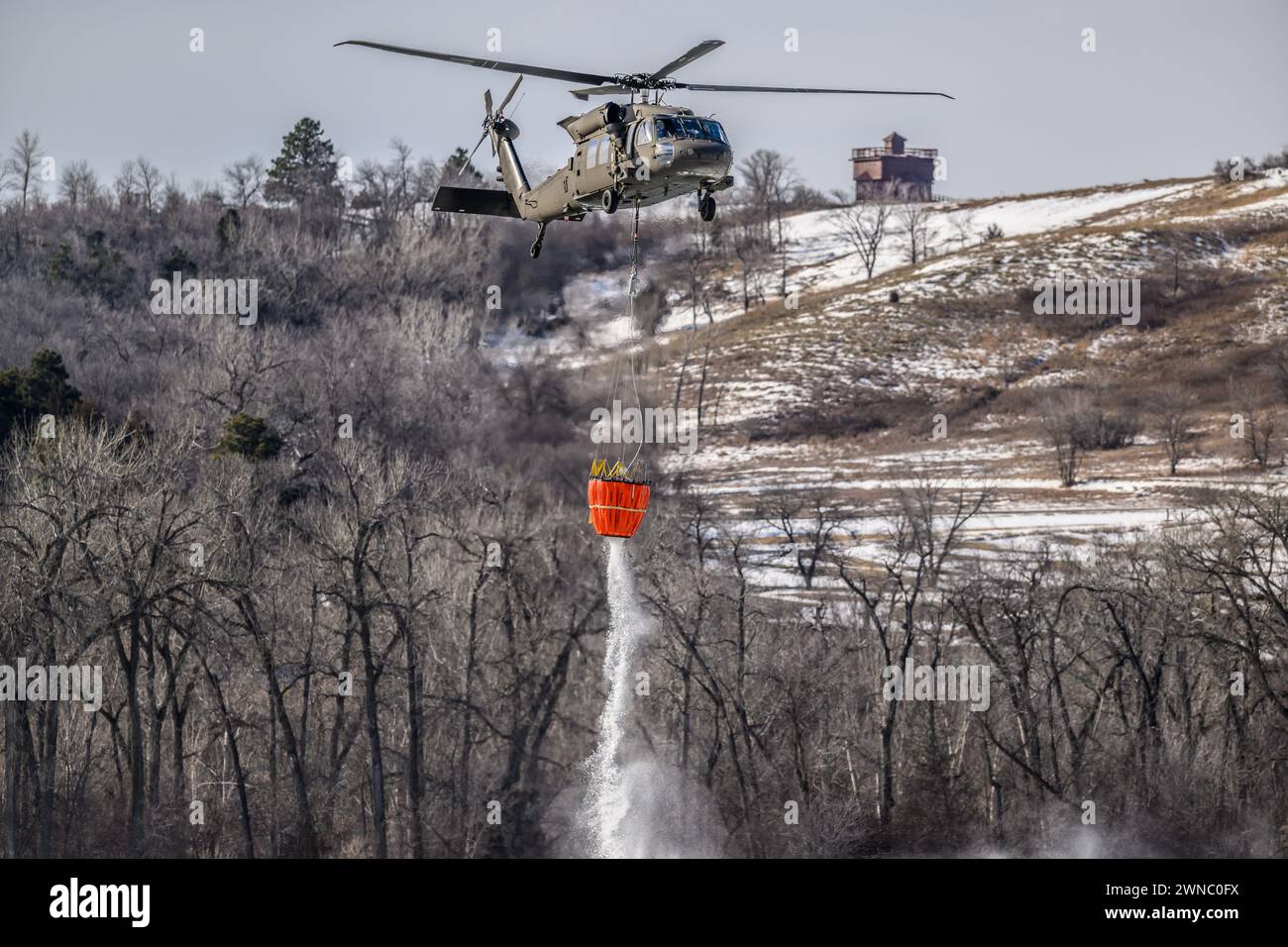 A North Dakota National Guard UH-60 Black Hawk helicopter drops 660 ...