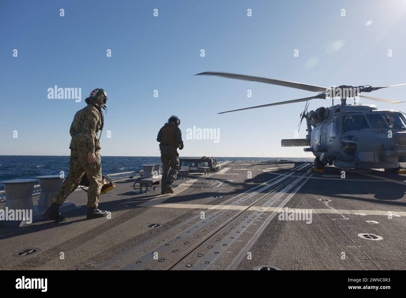Sailors refuel an MH-60R Sea Hawk helicopter assigned to Helicopter ...