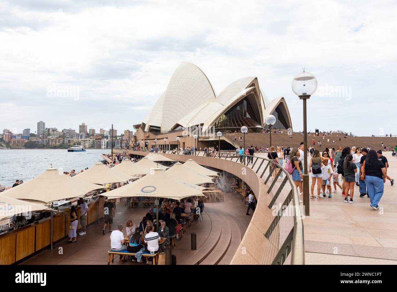 Sydney Opera house and Opera bar with tourists and visitors to the ...