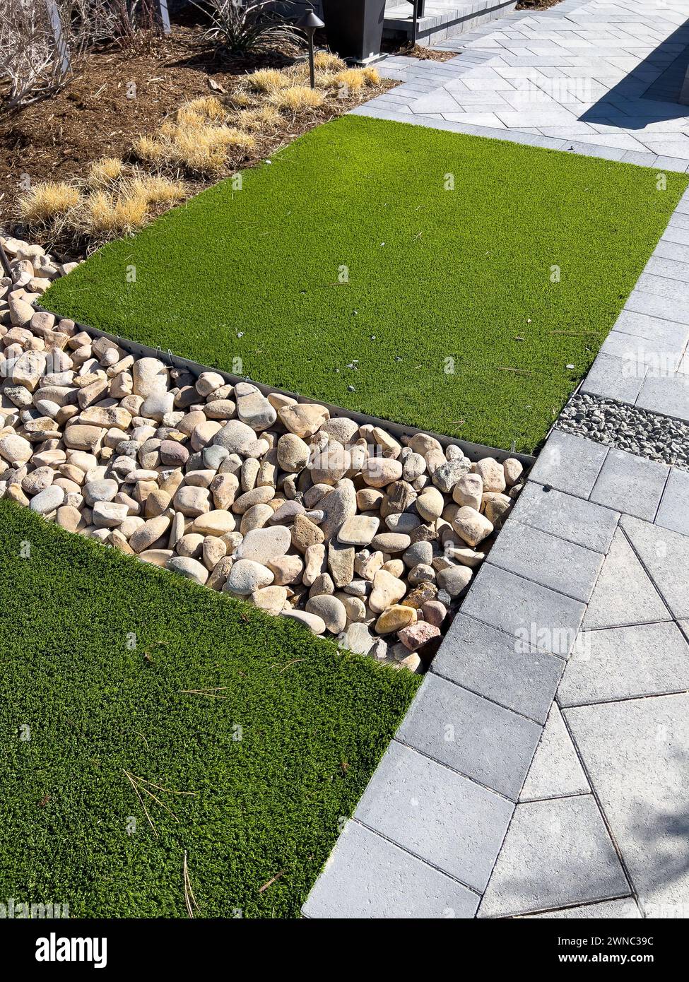 Modern Landscaping with Artificial Turf, Pebble Path, and Pavers Stock ...