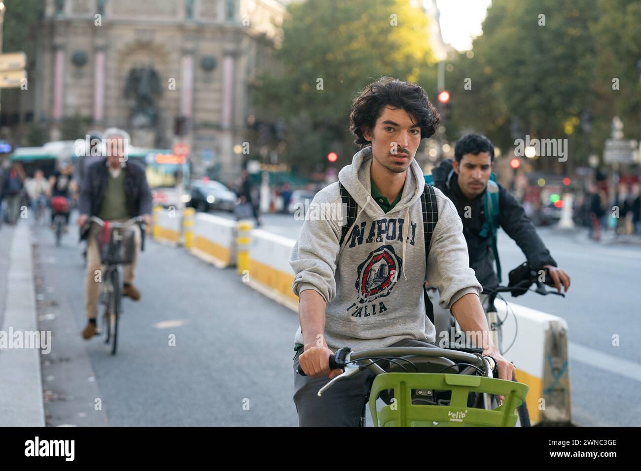 People in Paris riding their bikes, bicycles and scooters Stock Photo ...