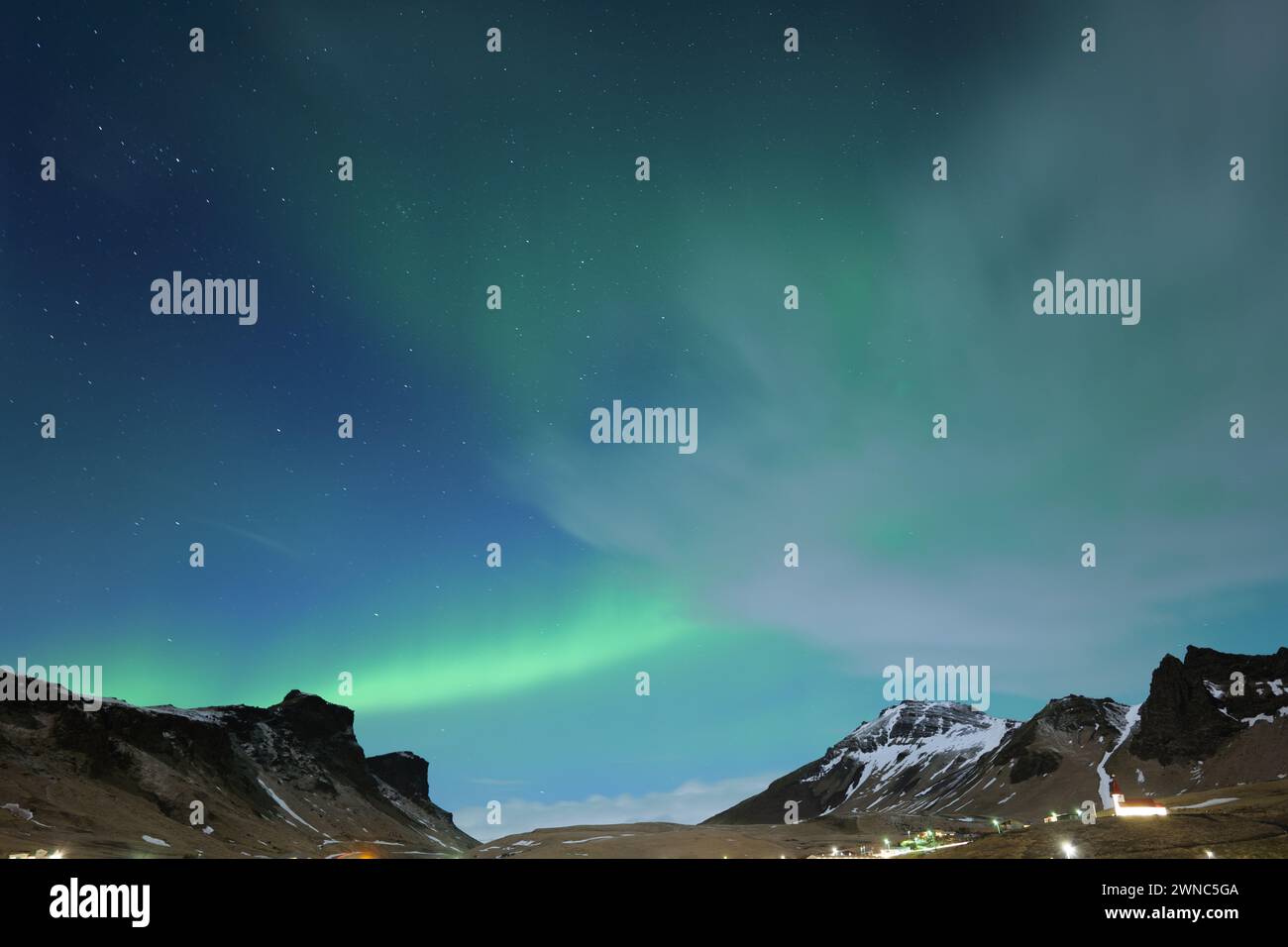 Northern Lights and Clouds in Iceland in the Winter Night Sky in Vik ...