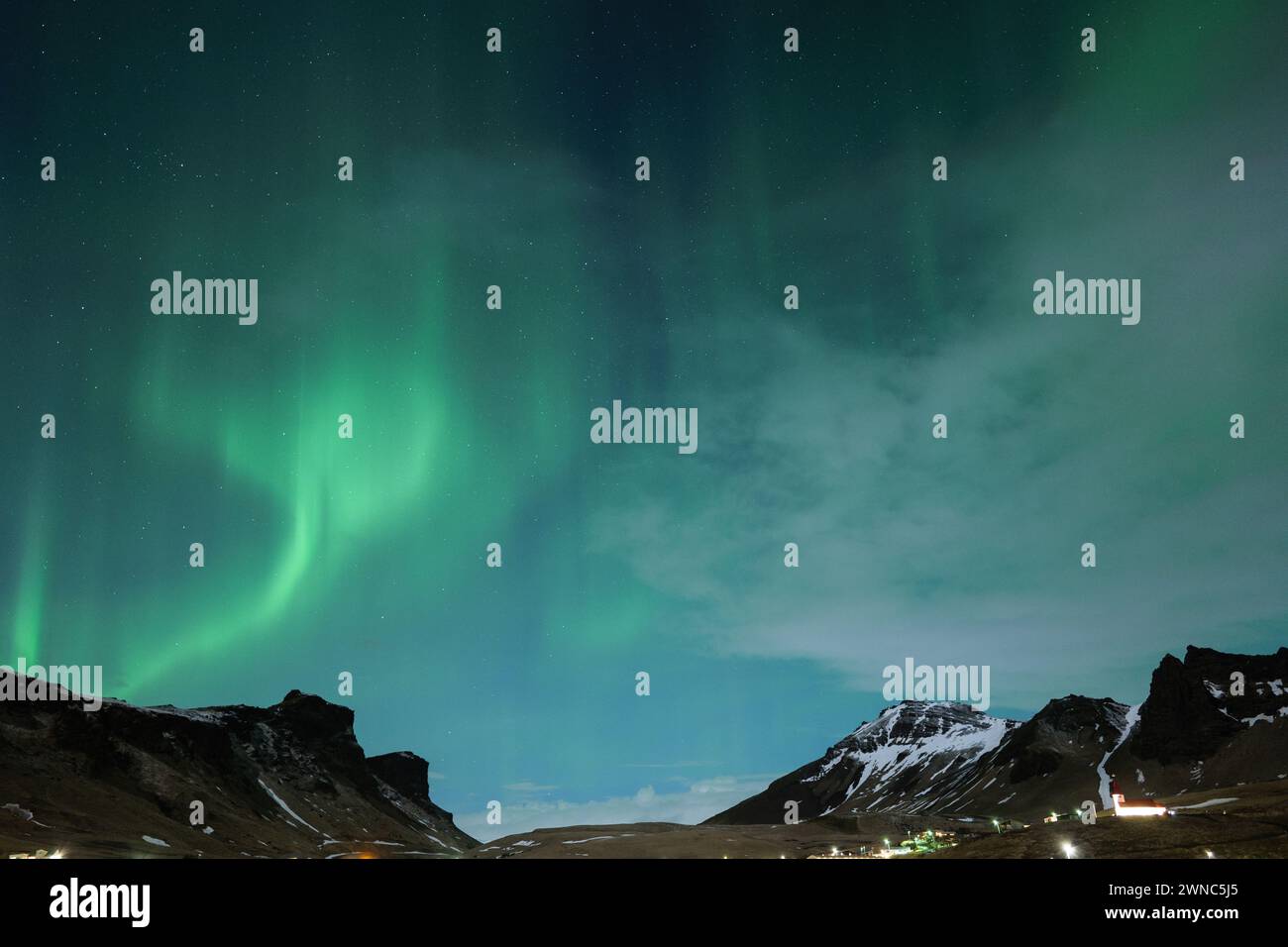 Northern Lights and Clouds in Iceland in the Winter Night Sky in Vik ...