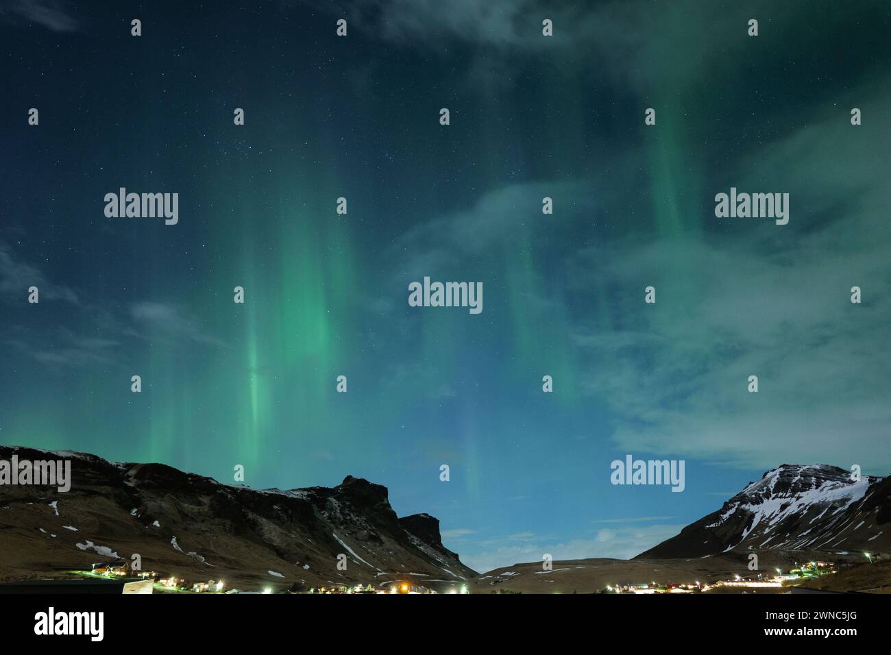 Northern Lights and Clouds in Iceland in the Winter Night Sky in Vik ...