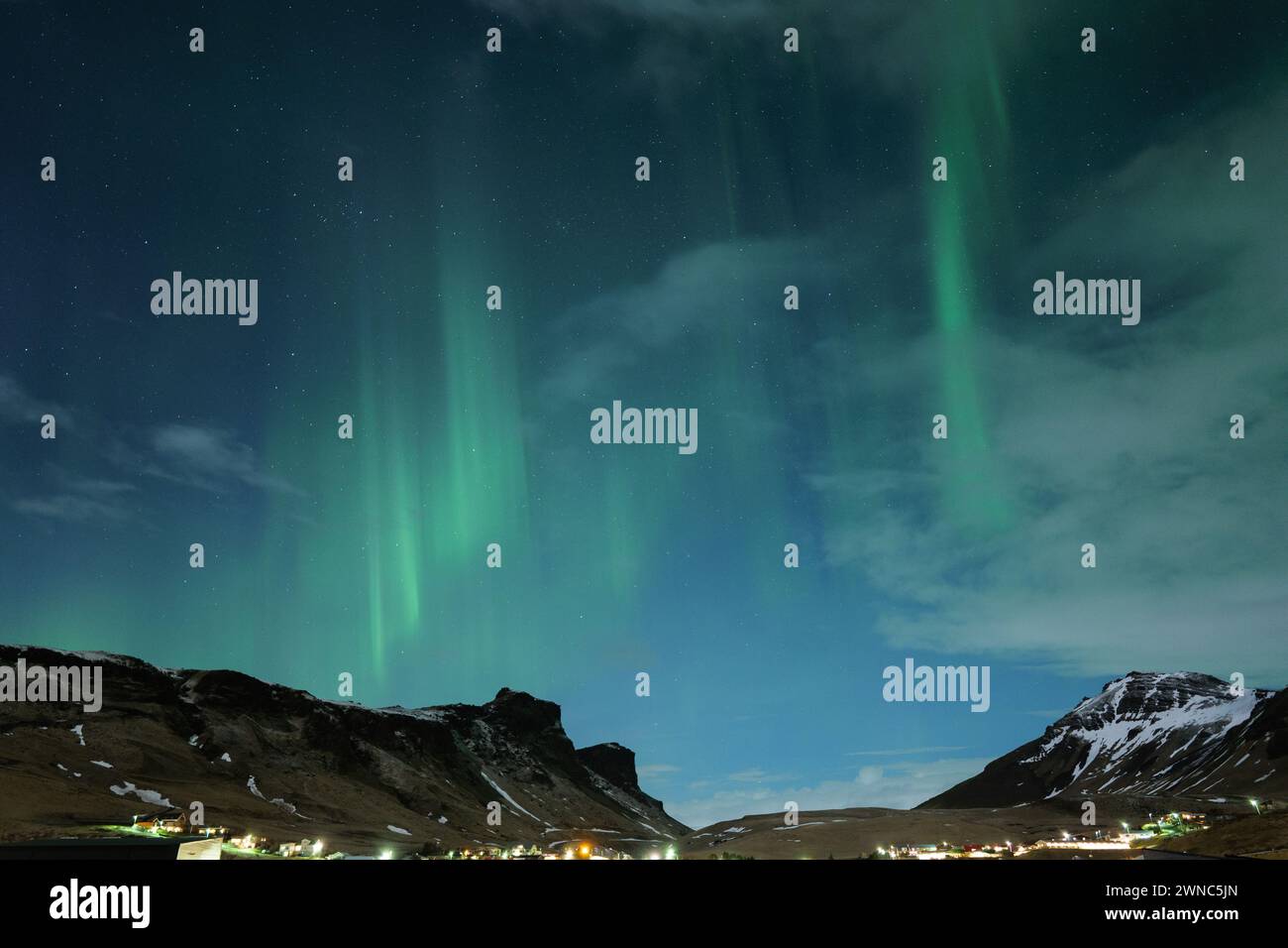 Northern Lights and Clouds in Iceland in the Winter Night Sky in Vik ...