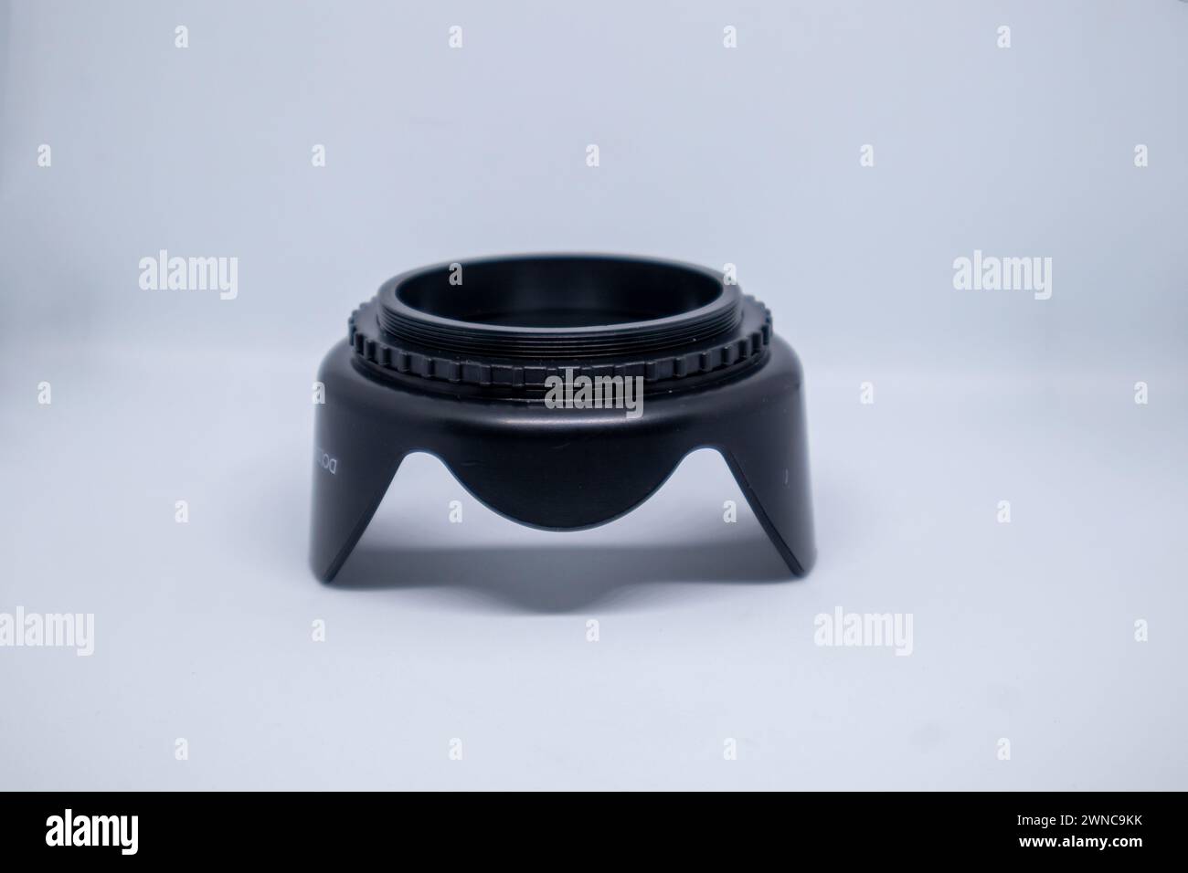 flower type lens protector made of plastic material on a white ...