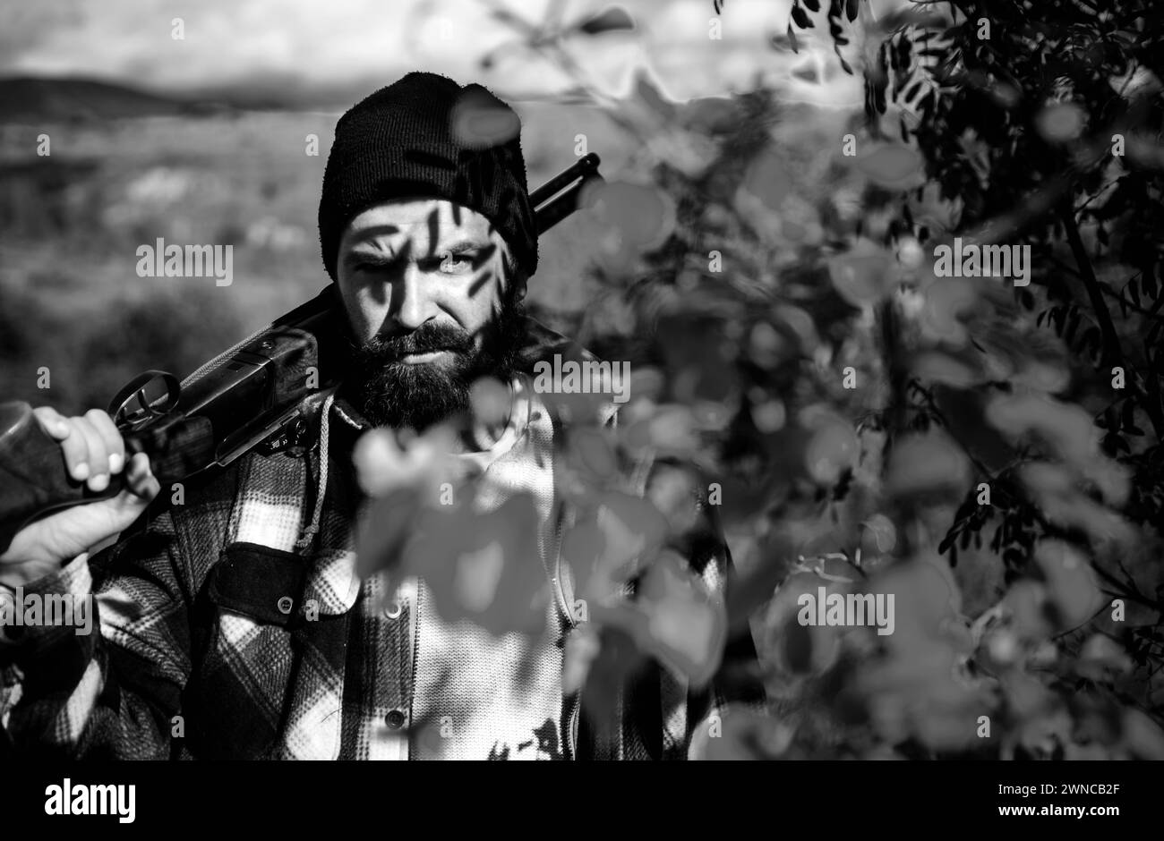 Bearded hunter huntering. Hunting period, autumn season. Hunter with a ...