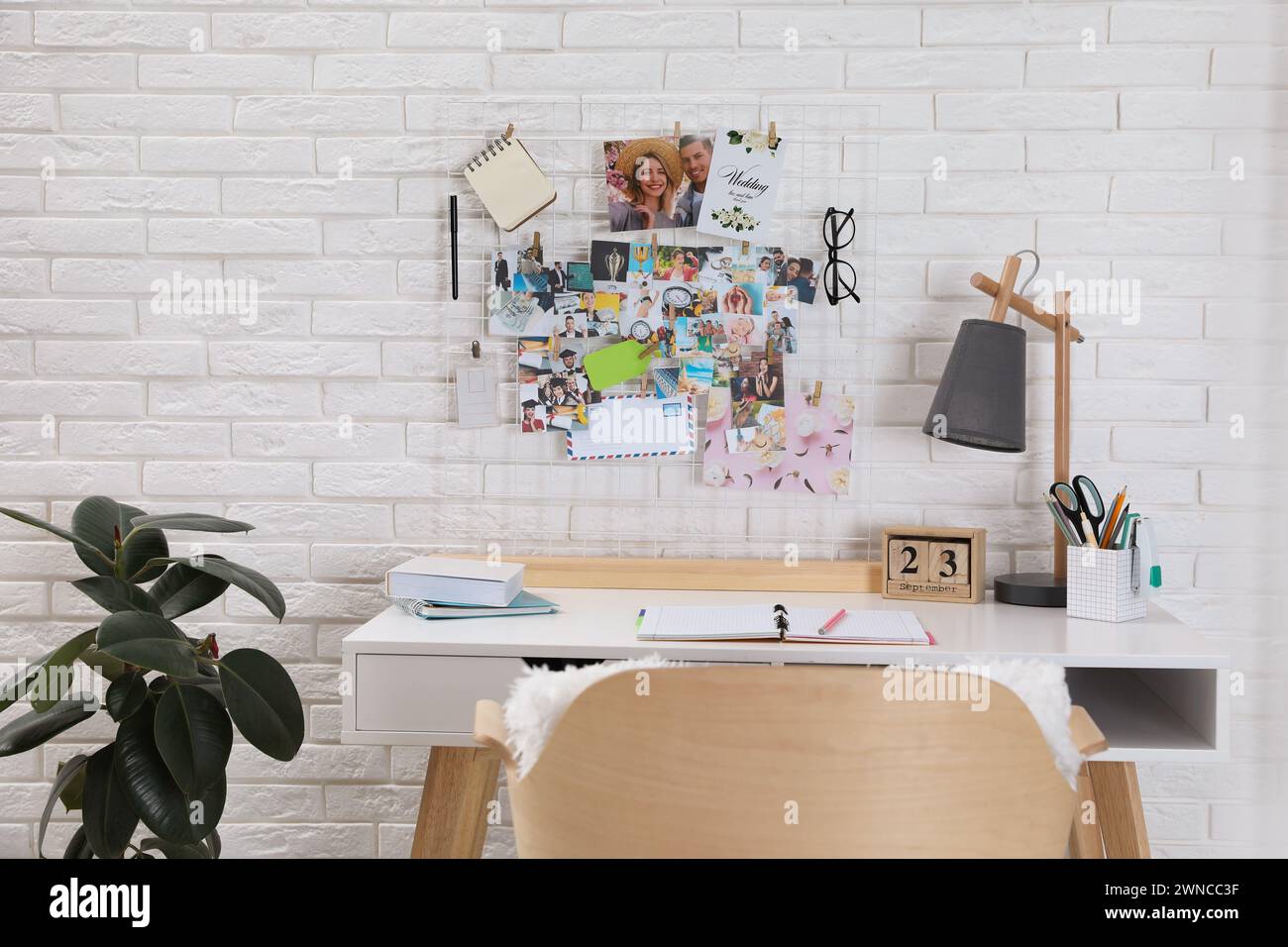 Stylish workplace with stationery and vision board Stock Photo - Alamy