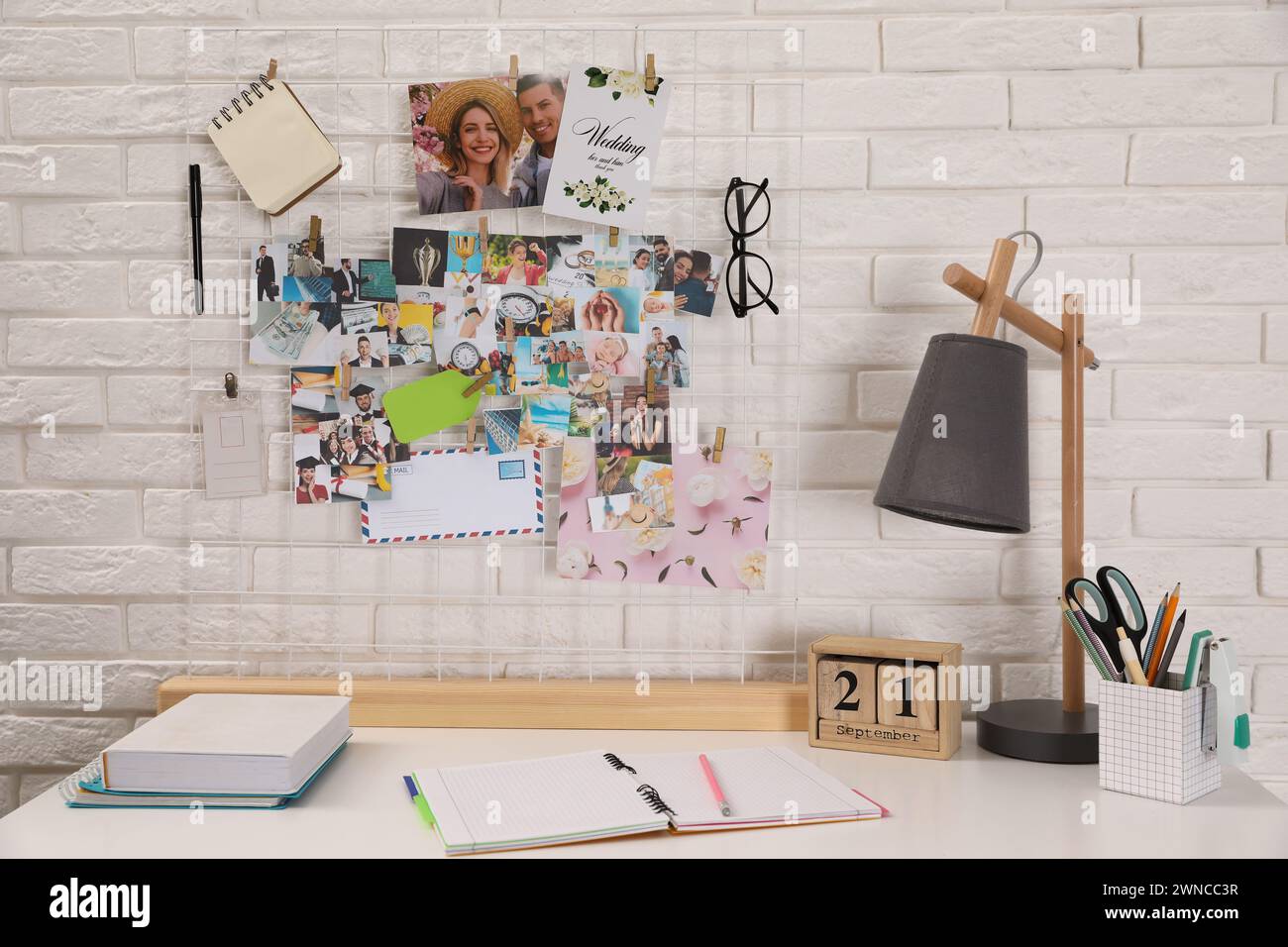 Stylish workplace with stationery and vision board Stock Photo - Alamy