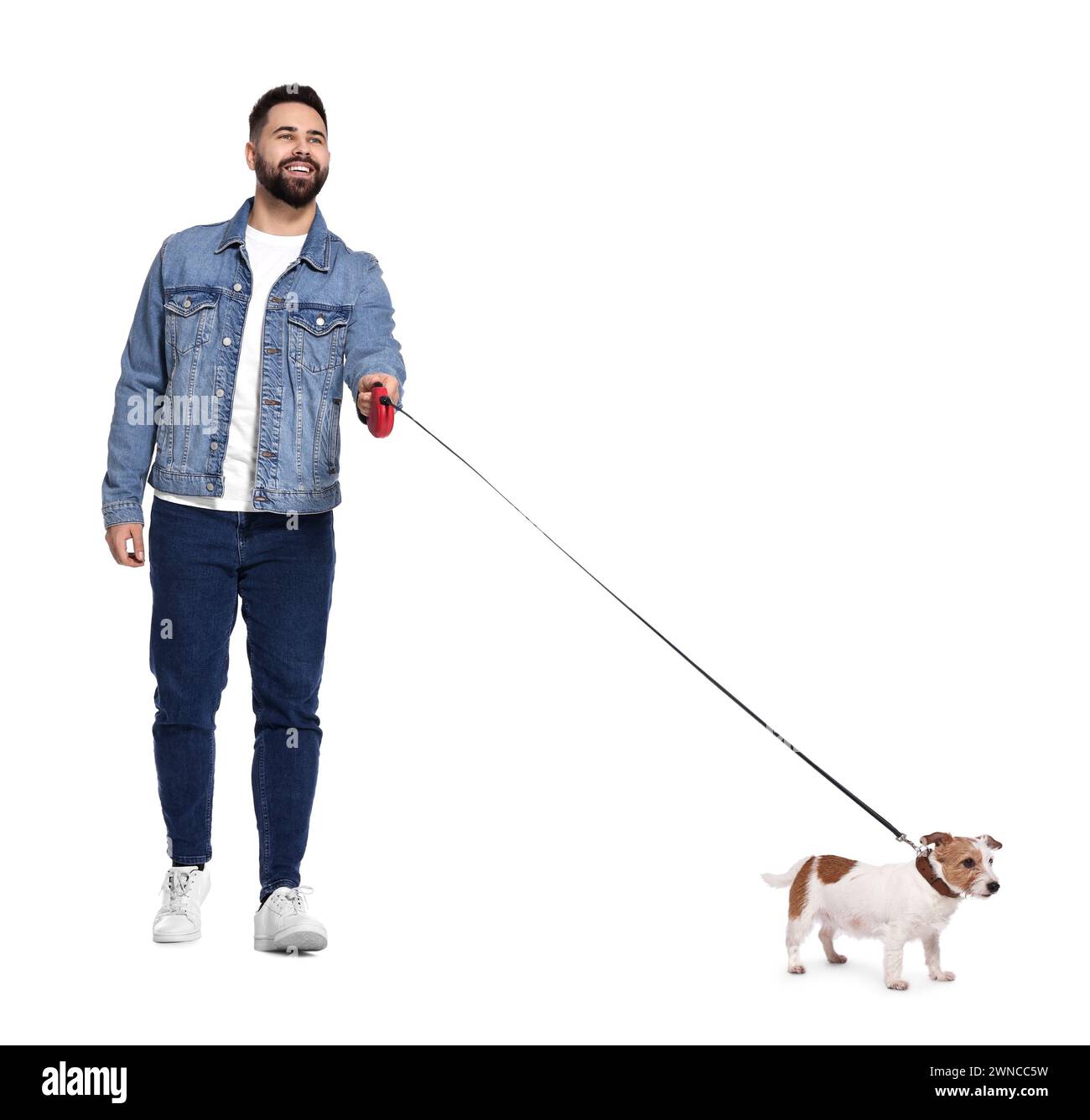 Smiling man walking with dog on white background Stock Photo - Alamy